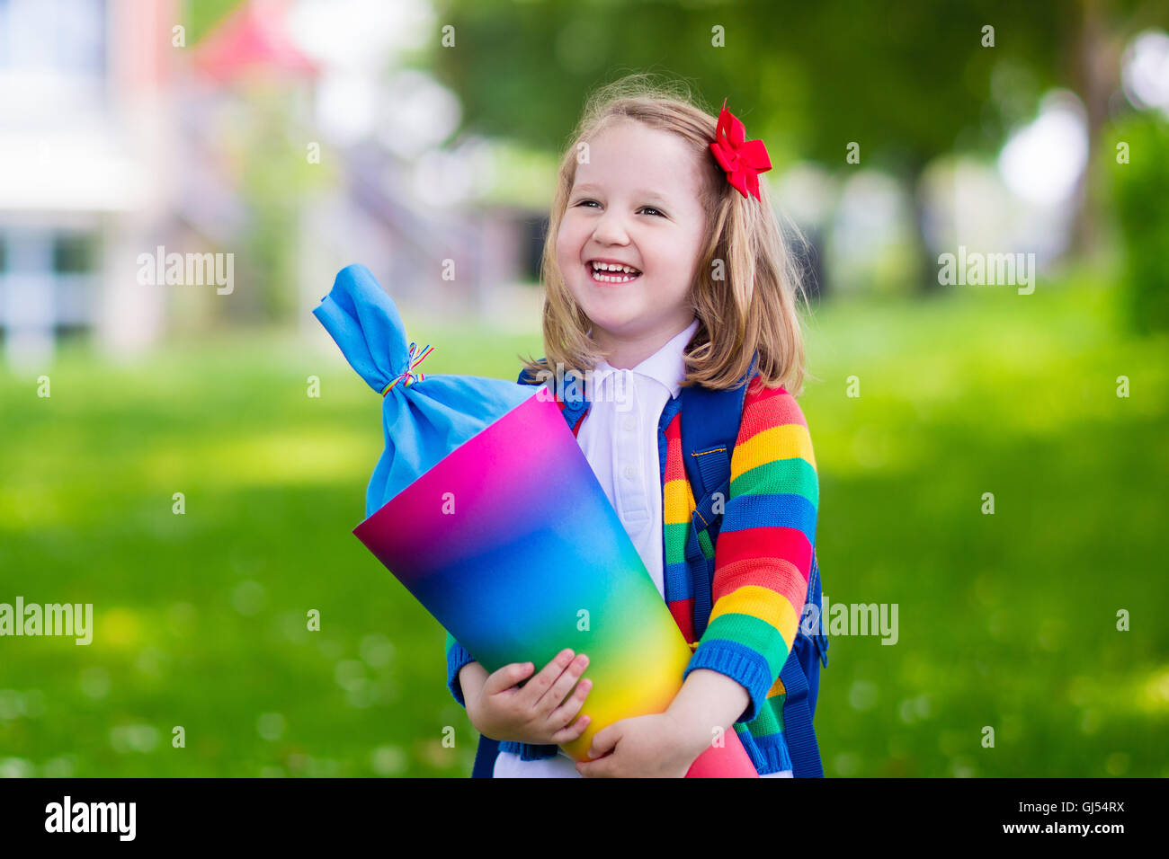 Happy child holding traditional German candy cone on first school day ...