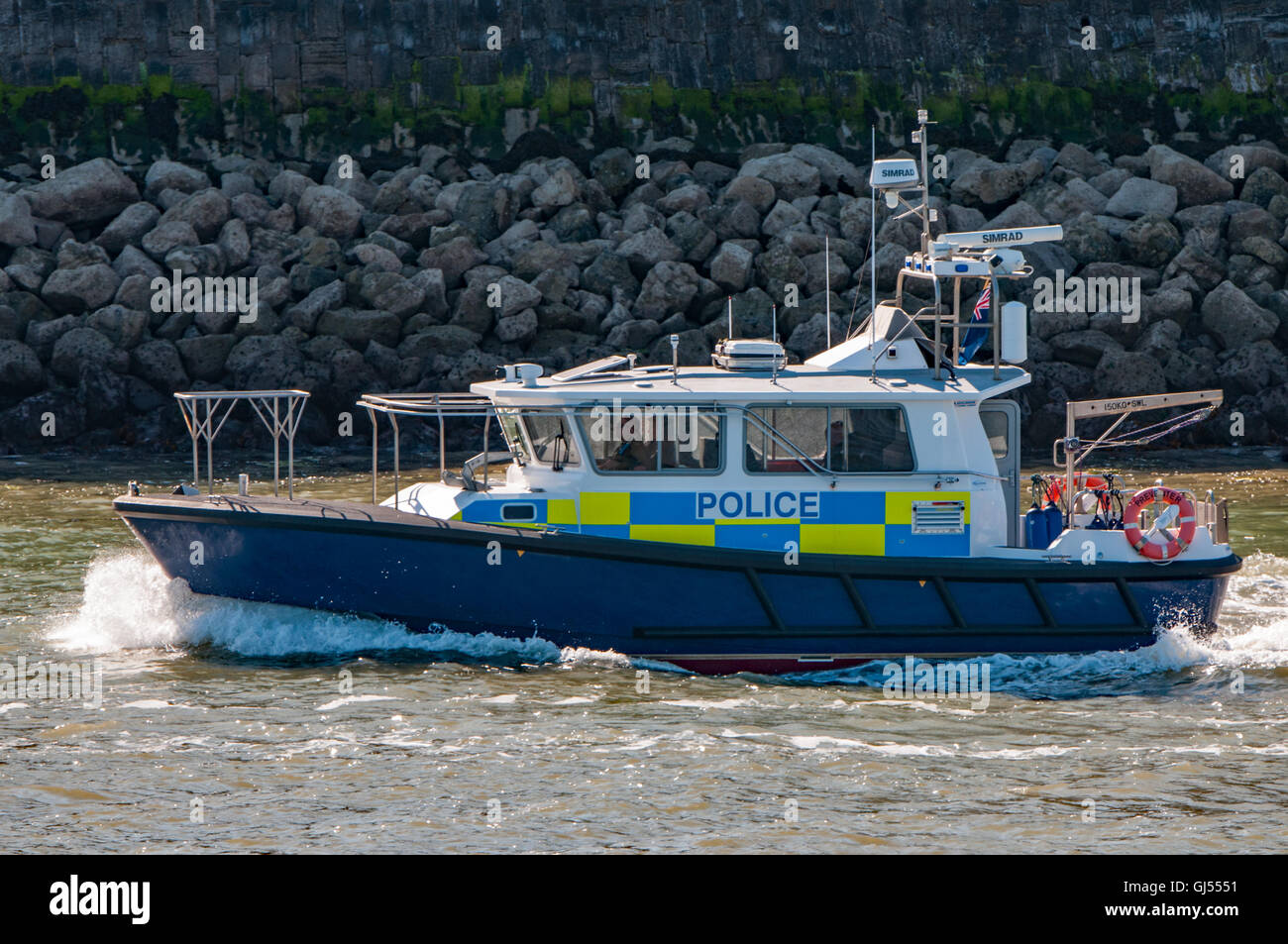 Hampshire Police Patrol Boat with a rocky sea wall background Stock ...
