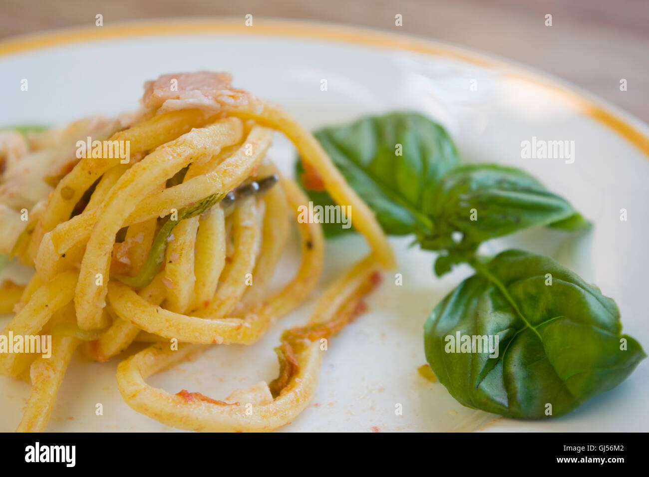 guitar spaghetti carbonara with cream and basil Stock Photo - Alamy