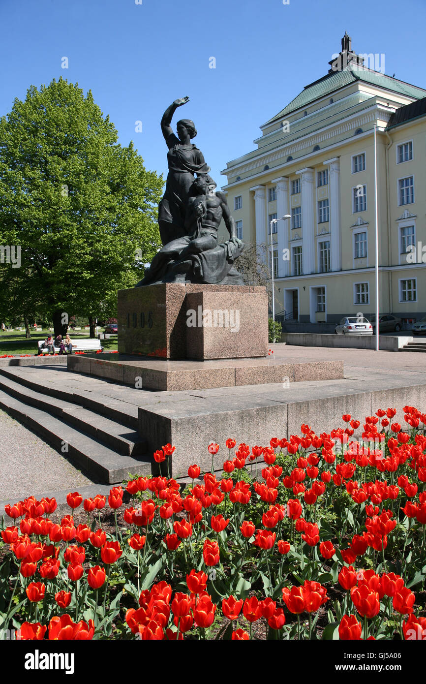 Tulips and statue in front of the Estonian National Opera and Estonia ...