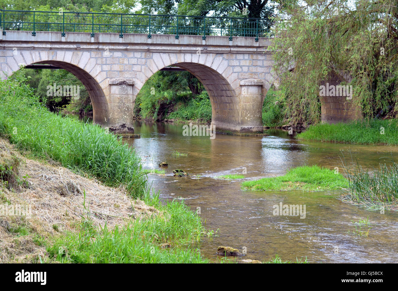 medieval stone bridge at a river in south france Stock Photo - Alamy