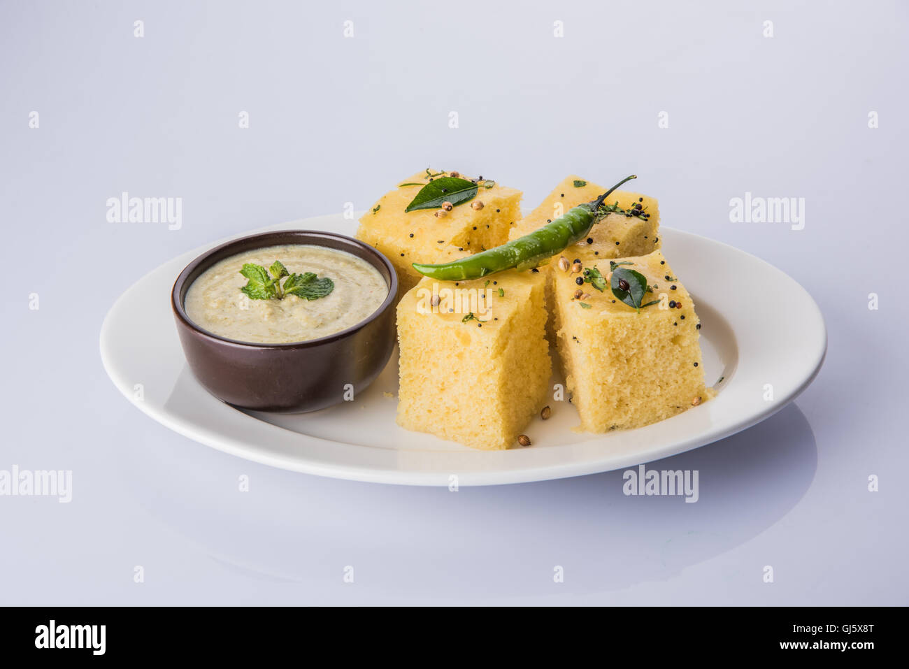 favourite Gujrati snack, khaman Dhokla made up of gram flour, semolina ...