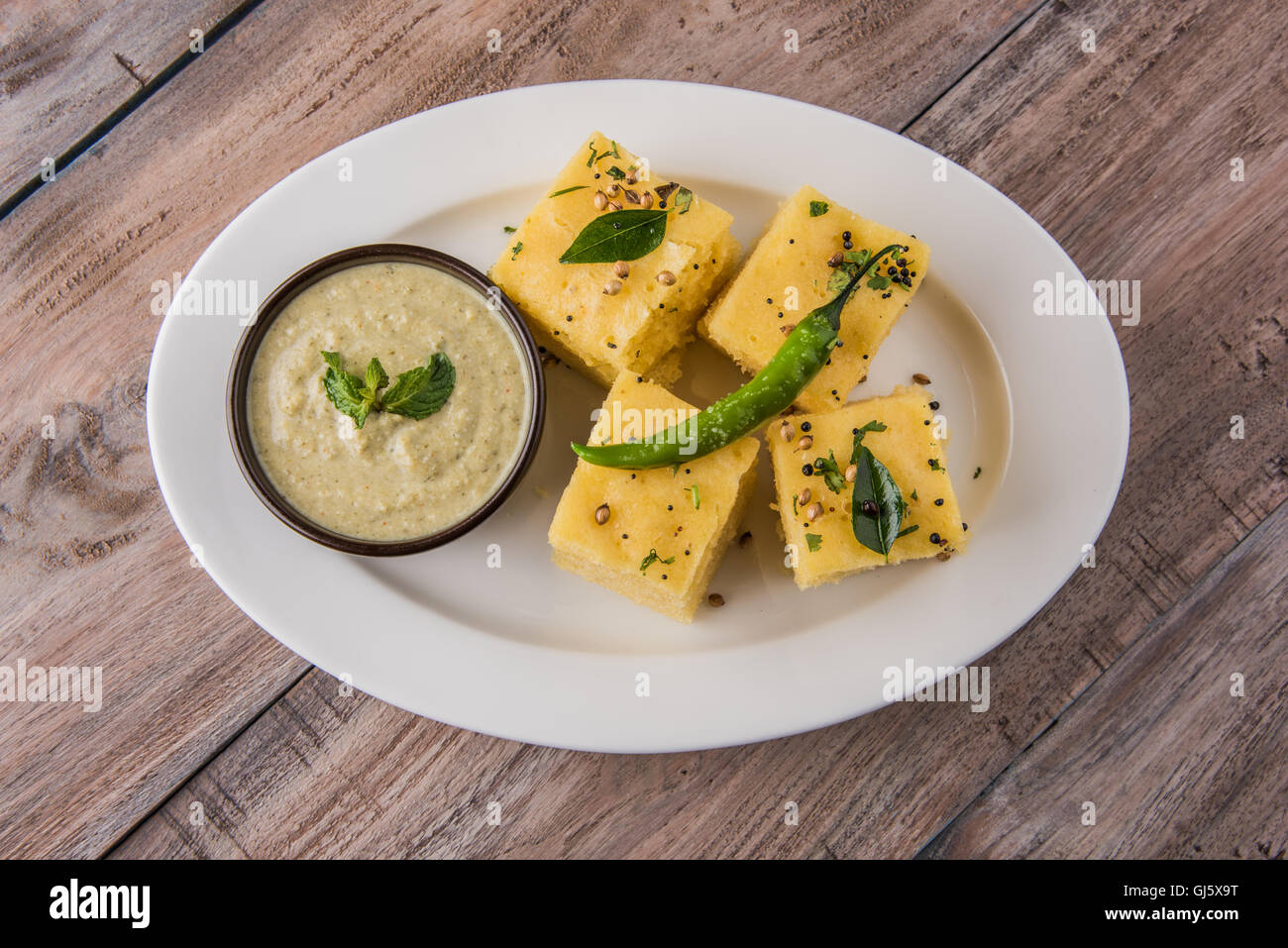 favourite Gujrati snack, khaman Dhokla made up of gram flour, semolina ...