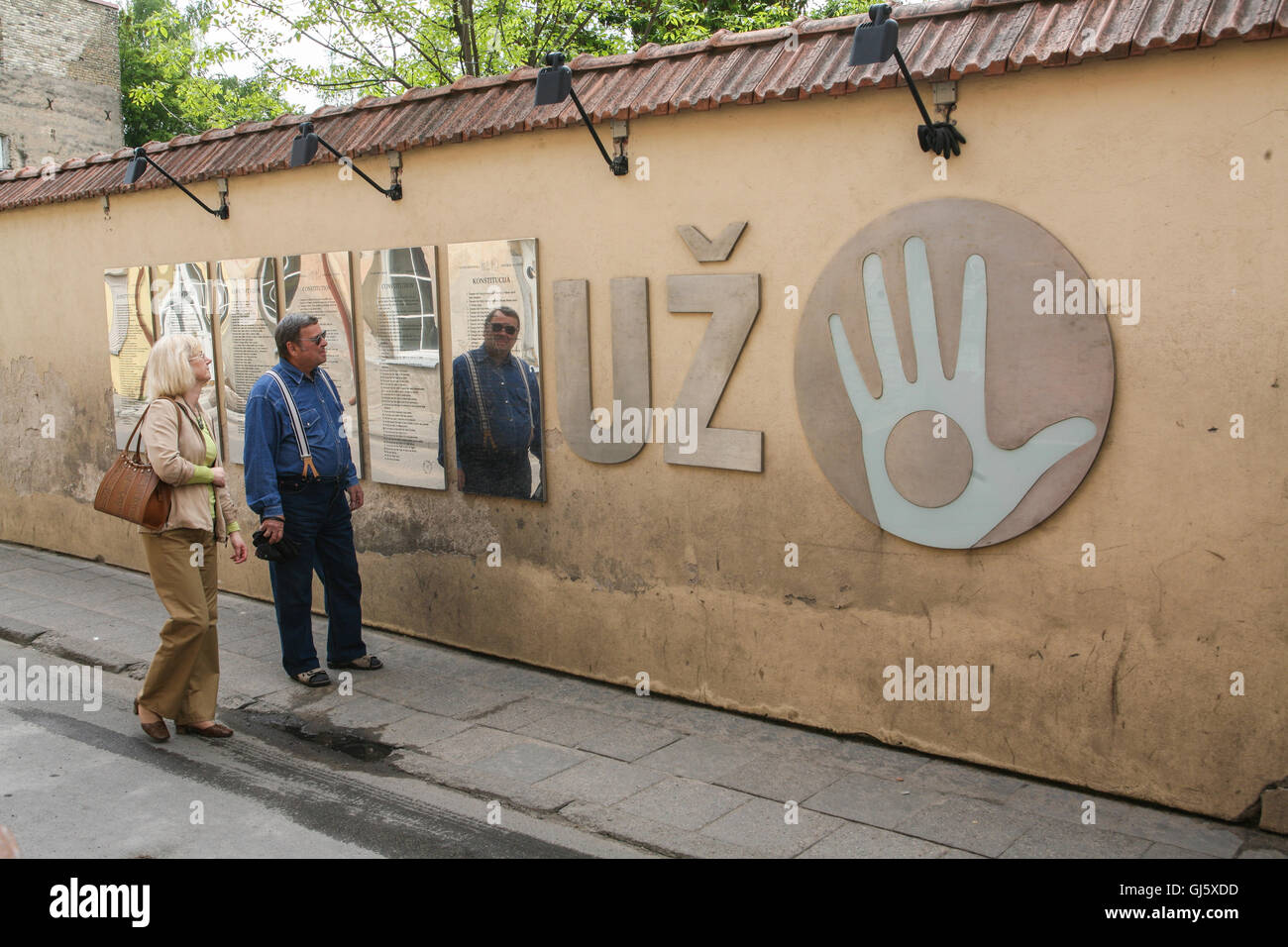Visitors reading the written constitution on the wall and symbol of ...