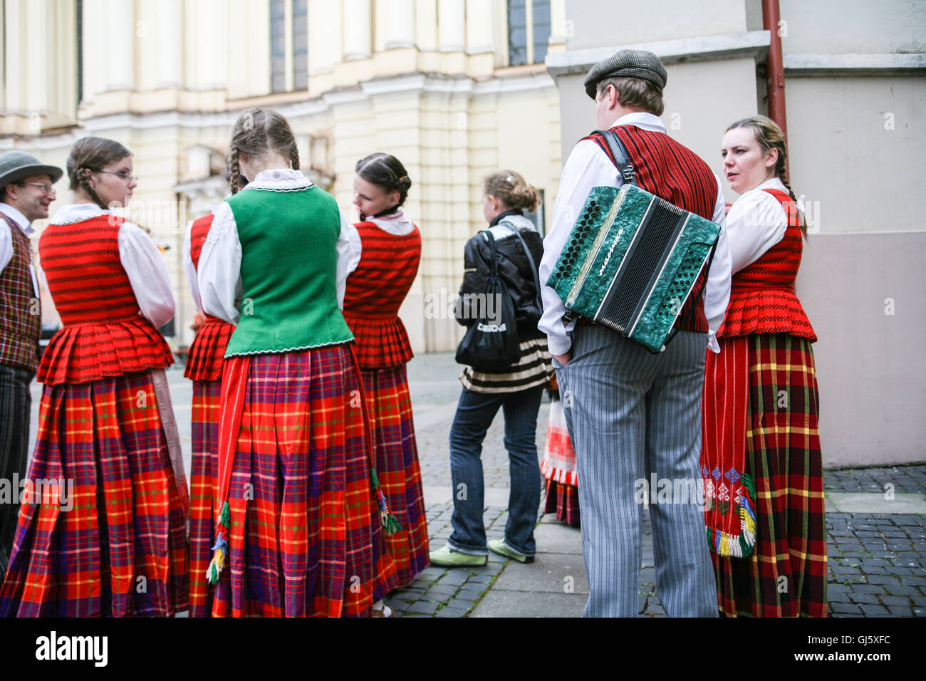 Traditional folk dance performers watching a folk performance and ...