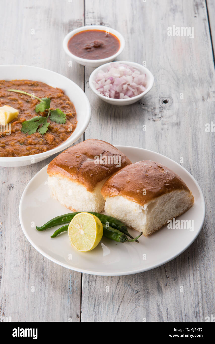 Pav Bhaji or paav bhaji, Indian spicy fast food with bread, onion and ...