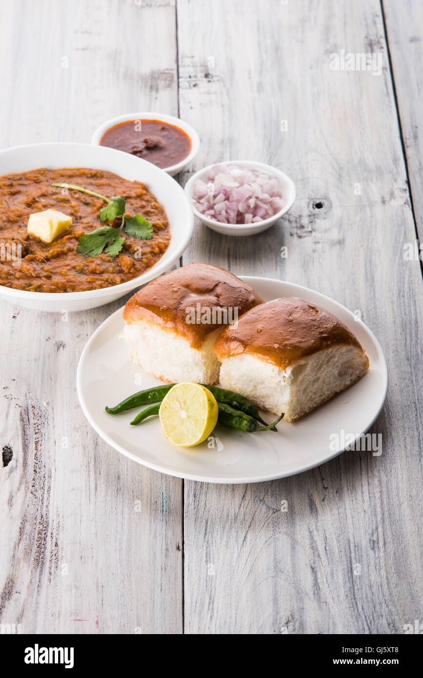 Pav Bhaji or paav bhaji, Indian spicy fast food with bread, onion and ...