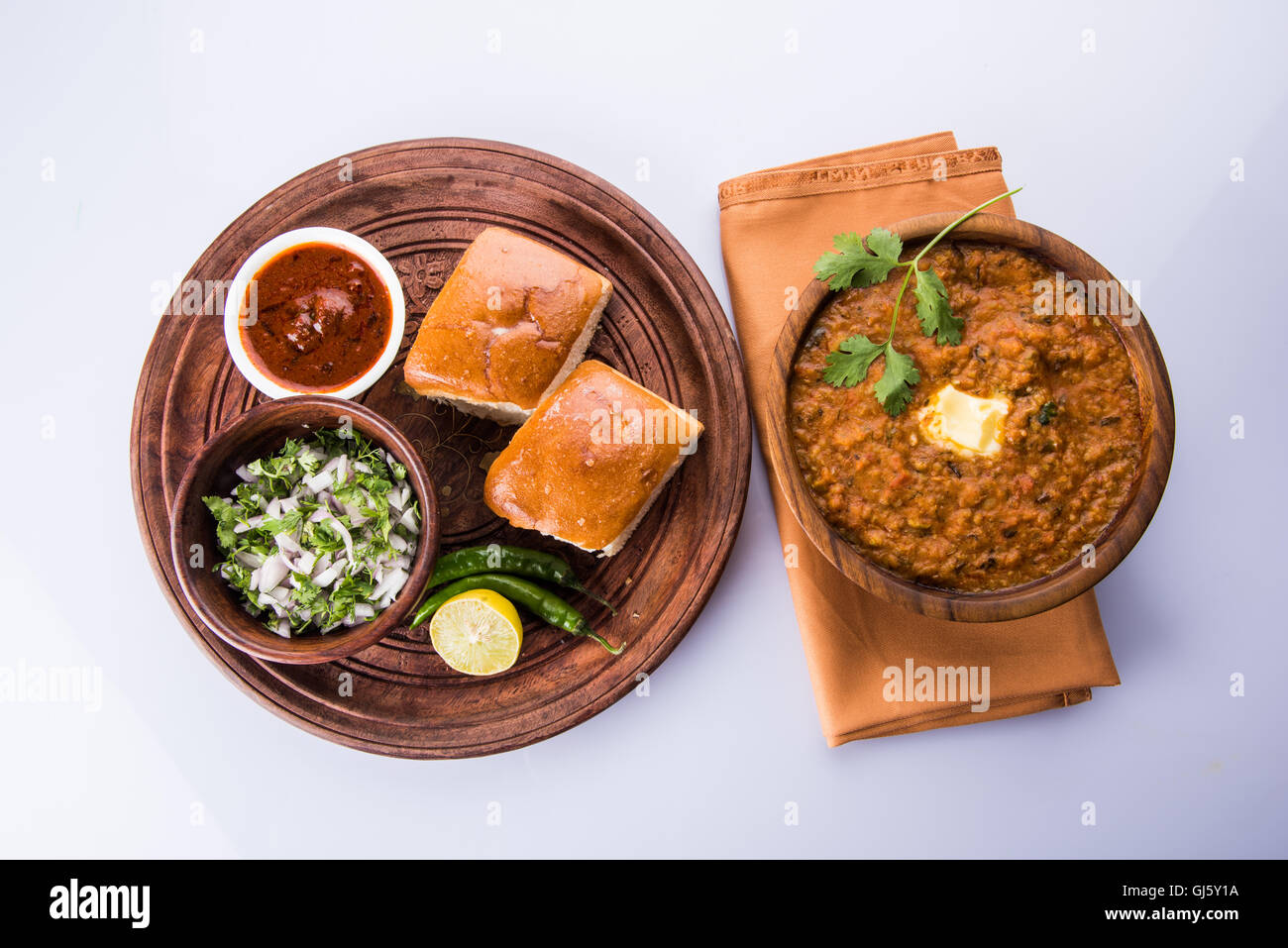 Pav Bhaji or paav bhaji, Indian spicy fast food with bread, onion and ...