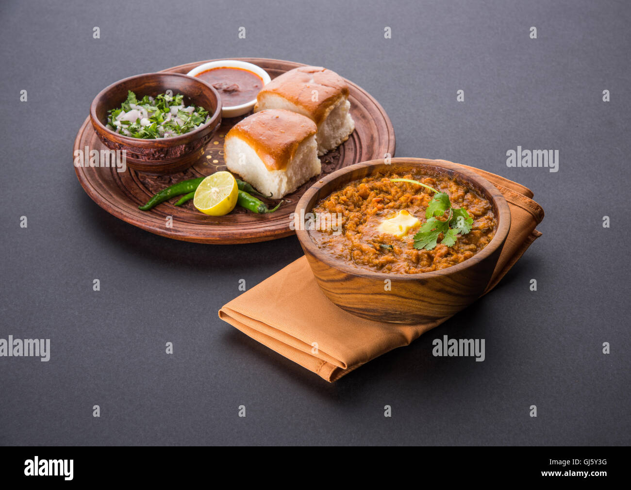 Pav Bhaji or paav bhaji, Indian spicy fast food with bread, onion and ...