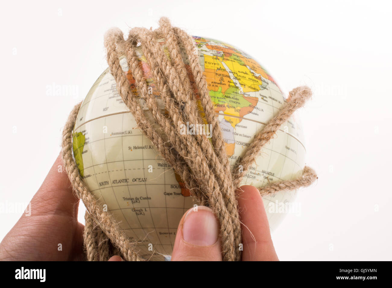 hands holding the globe wrapped in rope Stock Photo - Alamy