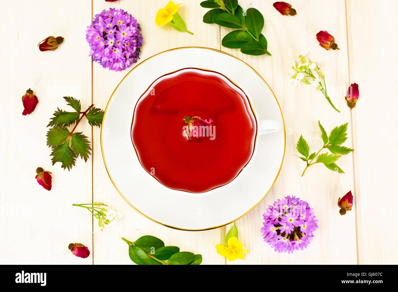 Red Rose Hibiscus Tea with Flowers Stock Photo - Alamy