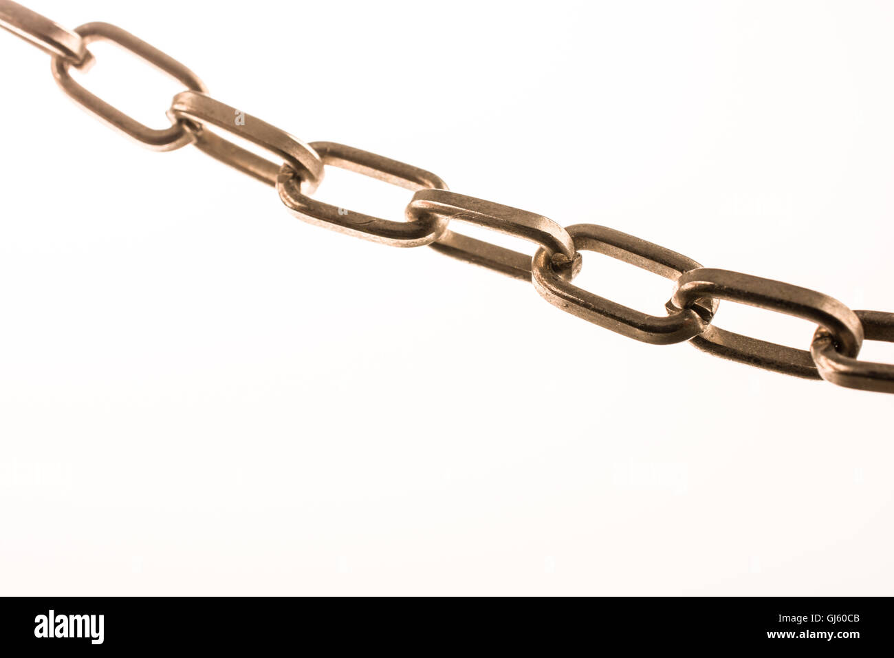 gold color metal chain on white background Stock Photo - Alamy