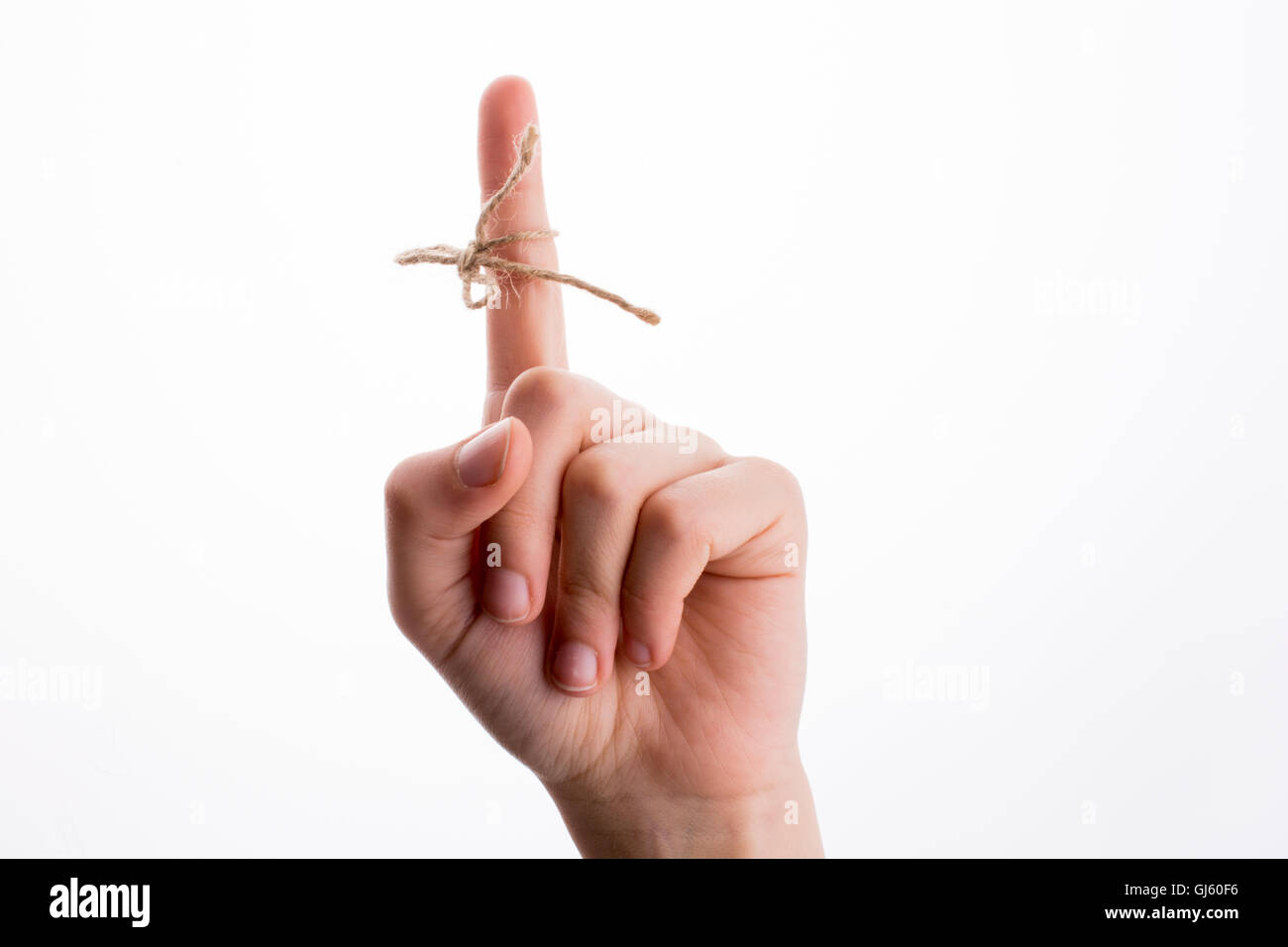 Hand tied with a thread like a ribbon on a white background Stock Photo ...