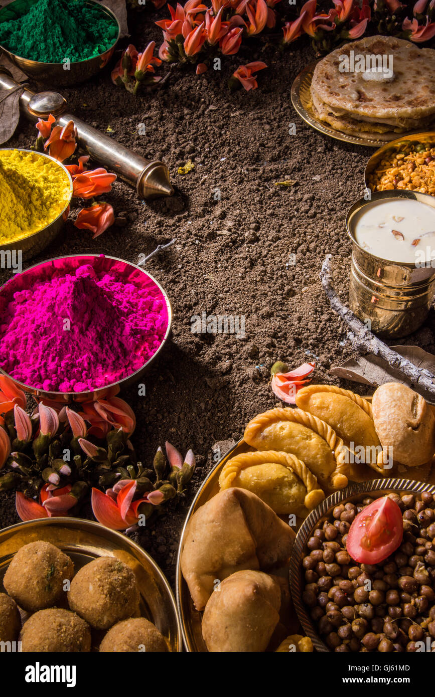holi festival food with colours, indian festival holi, samosa, kachori ...
