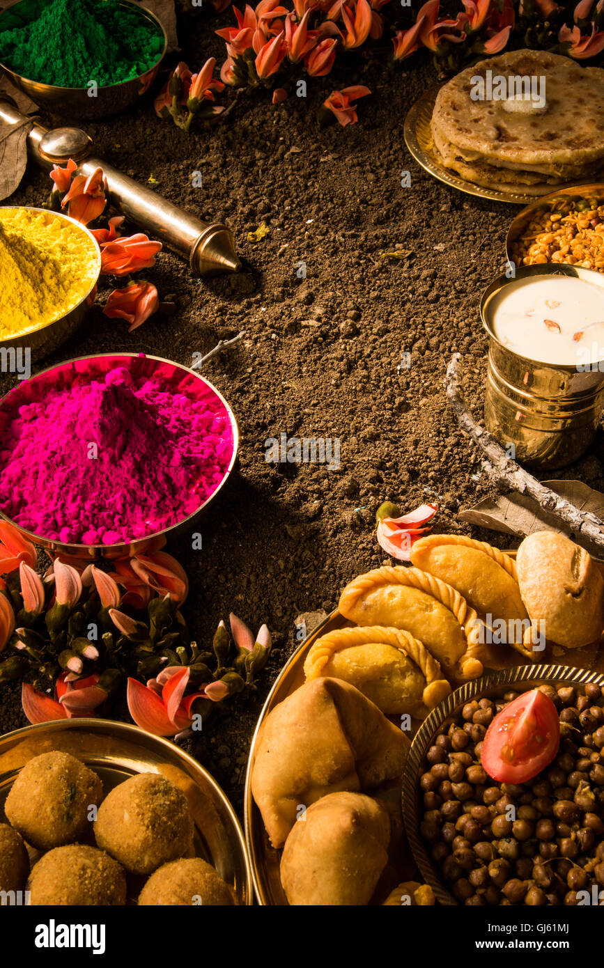 holi festival food with colours, indian festival holi, samosa, kachori ...