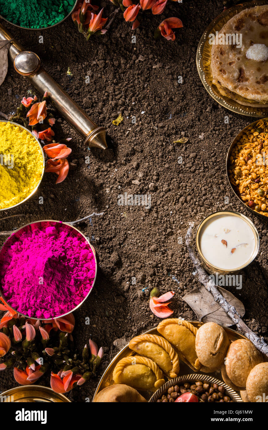 holi festival food with colours, indian festival holi, samosa, kachori ...