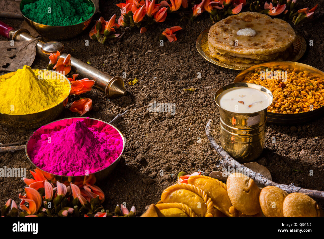 holi festival food with colours, indian festival holi, samosa, kachori ...