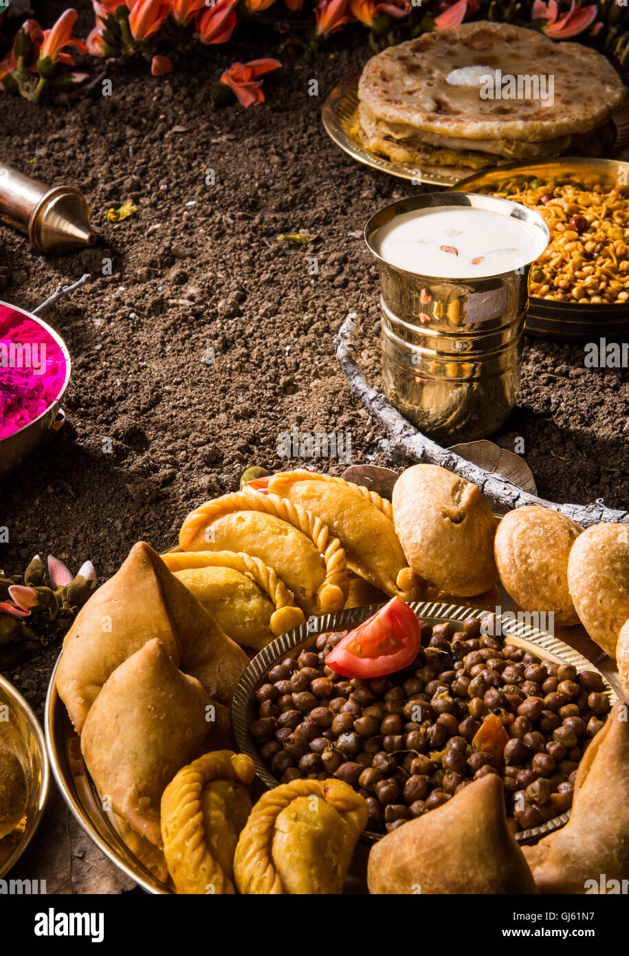 holi festival food with colours, indian festival holi, samosa, kachori ...