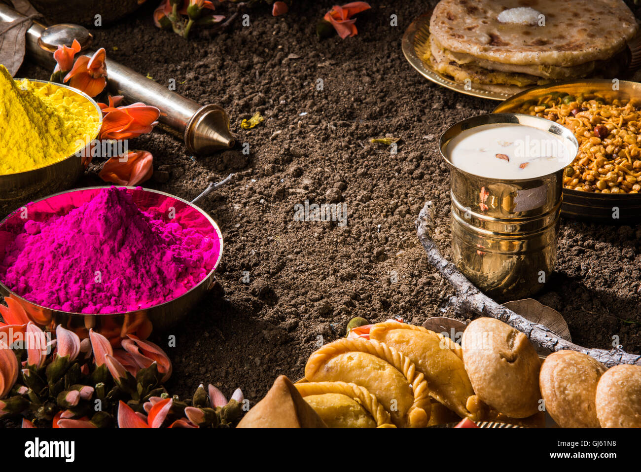 holi festival food with colours, indian festival holi, samosa, kachori ...