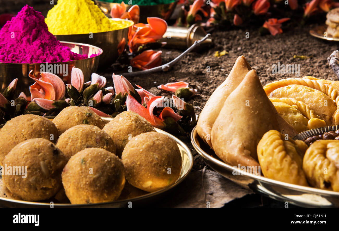 holi festival food with colours, indian festival holi, samosa, kachori ...