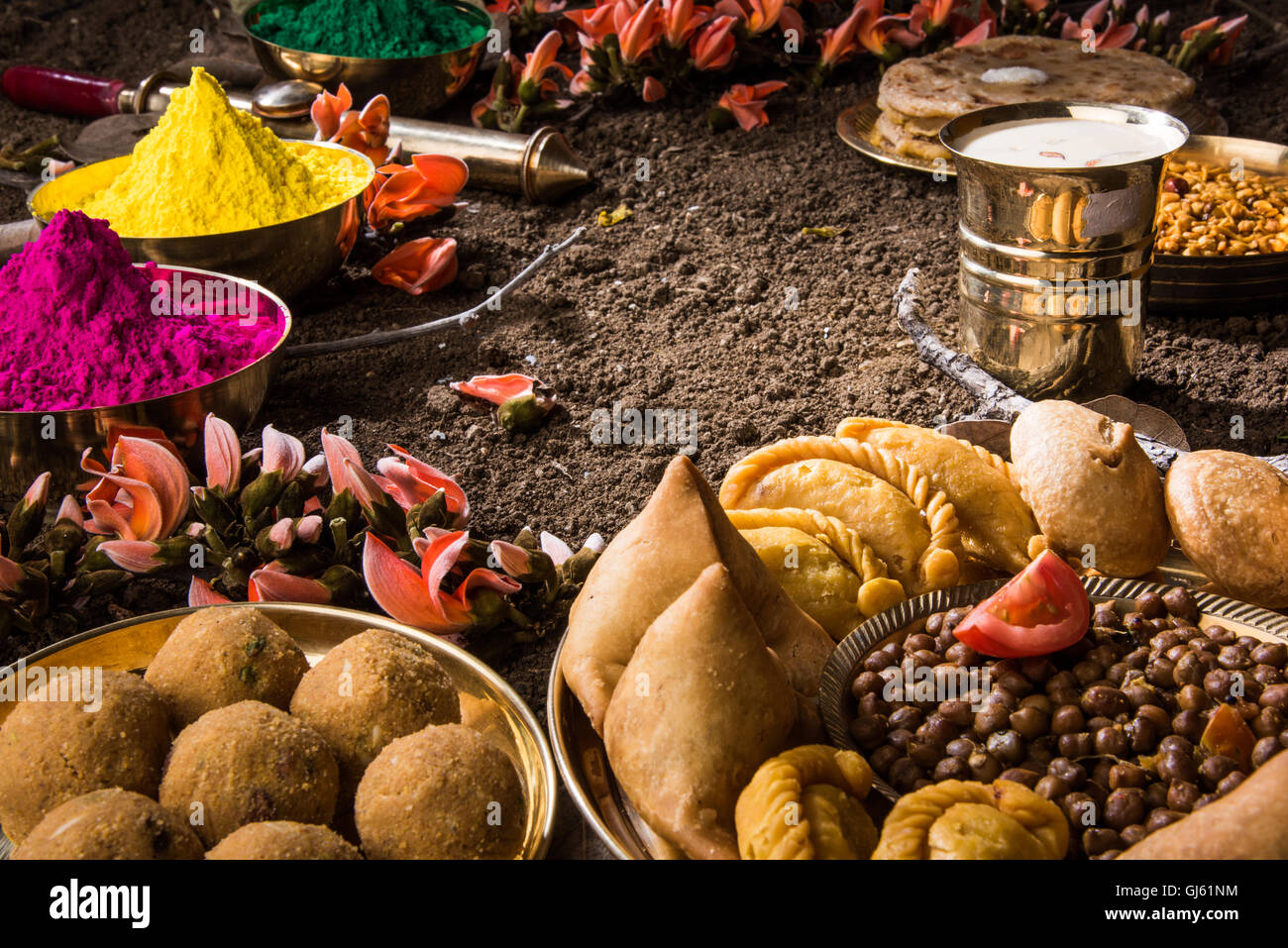 holi festival food with colours, indian festival holi, samosa, kachori ...