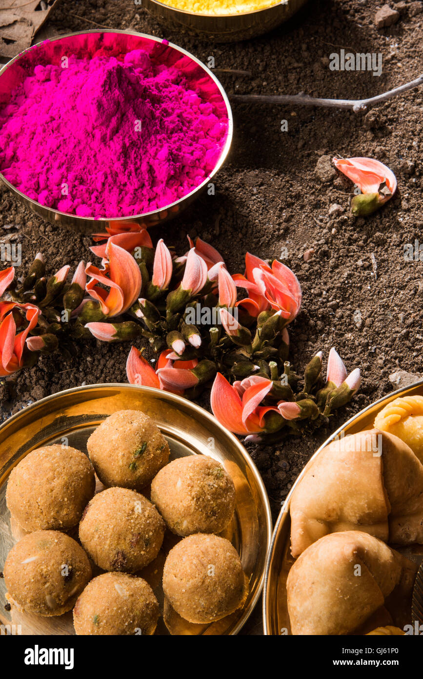 holi festival food with colours, indian festival holi, samosa, kachori ...