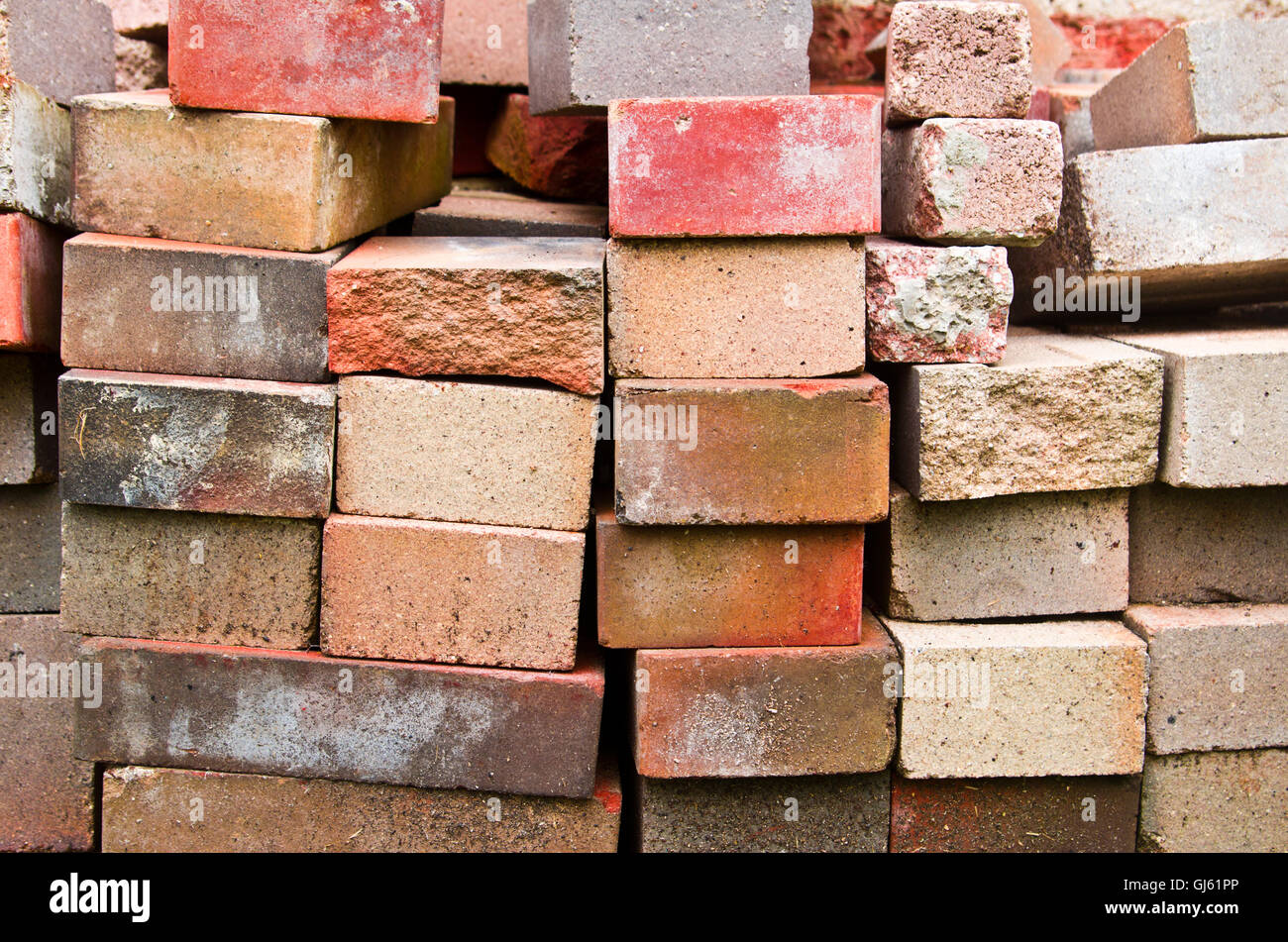 clay bricks of different color and type ready to be used to build walls ...