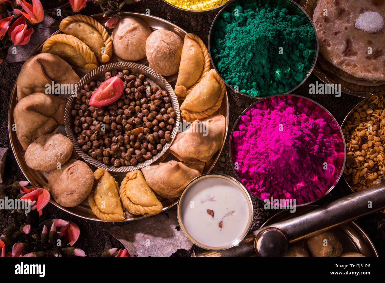 holi festival food with colours, indian festival holi, samosa, kachori ...
