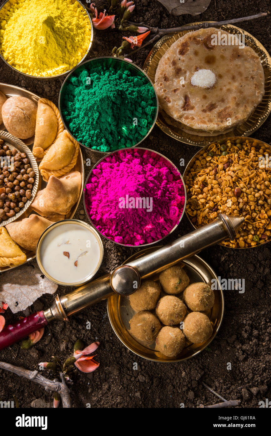 holi festival food with colours, indian festival holi, samosa, kachori ...
