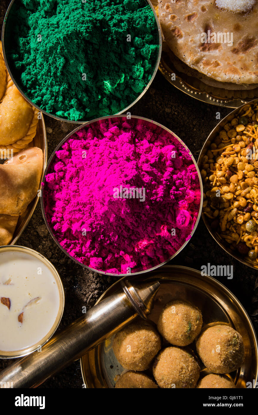holi festival food with colours, indian festival holi, samosa, kachori ...