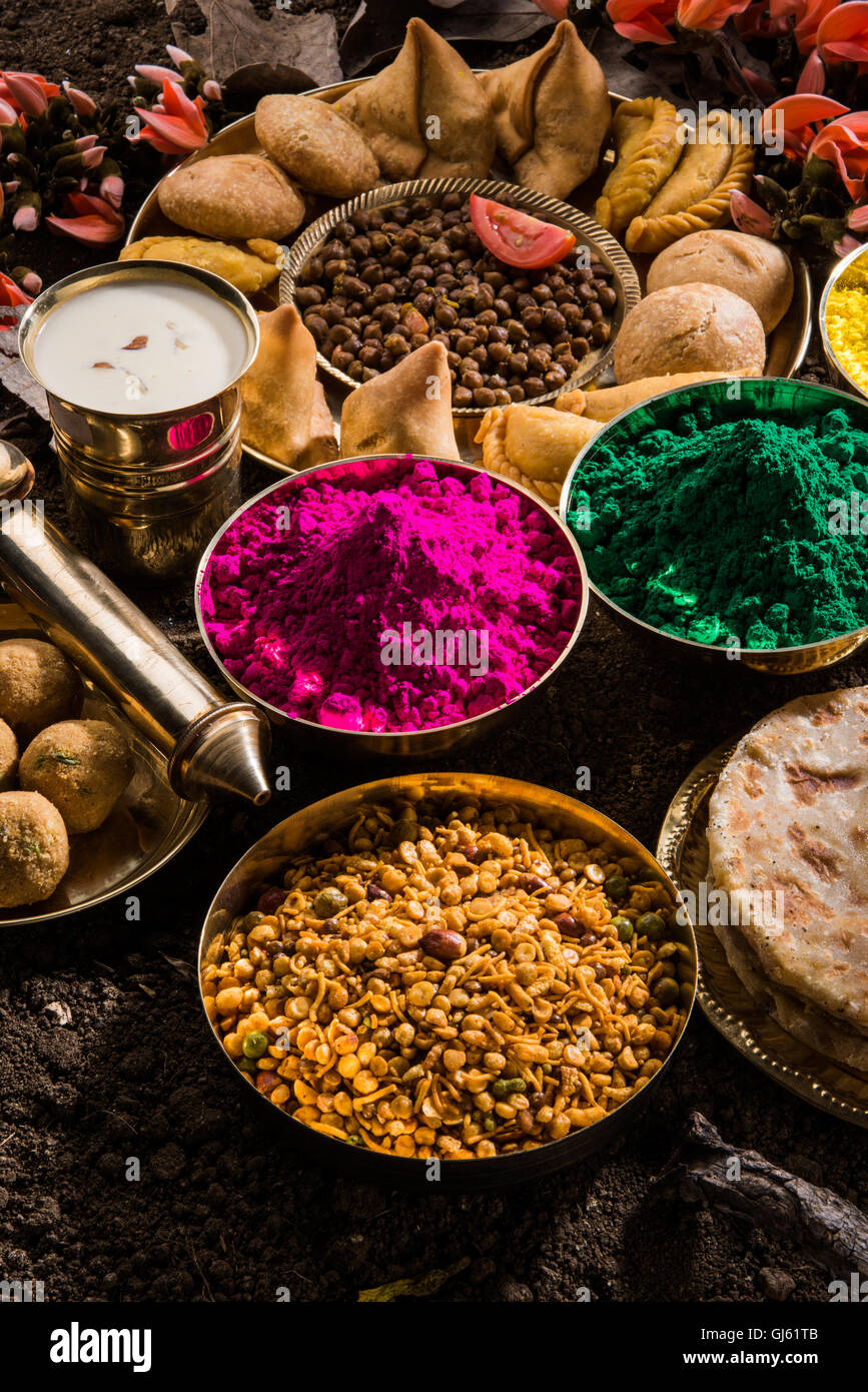 holi festival food with colours, indian festival holi, samosa, kachori ...