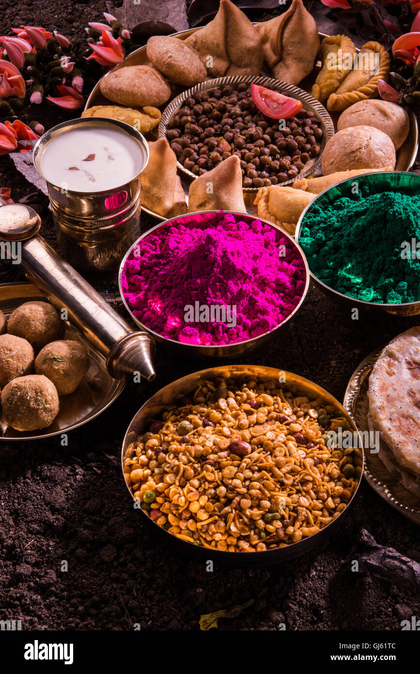 holi festival food with colours, indian festival holi, samosa, kachori ...