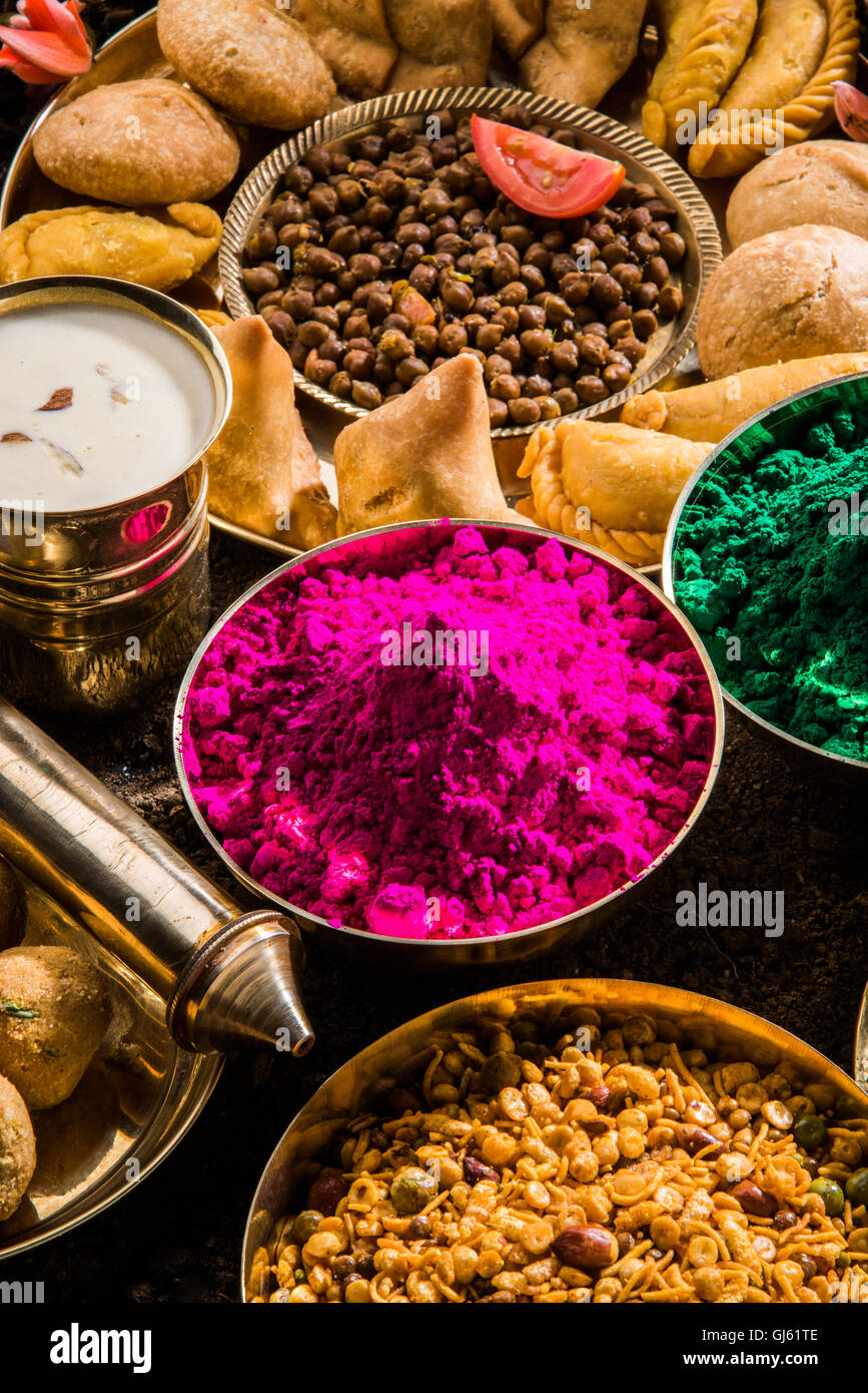 holi festival food with colours, indian festival holi, samosa, kachori ...