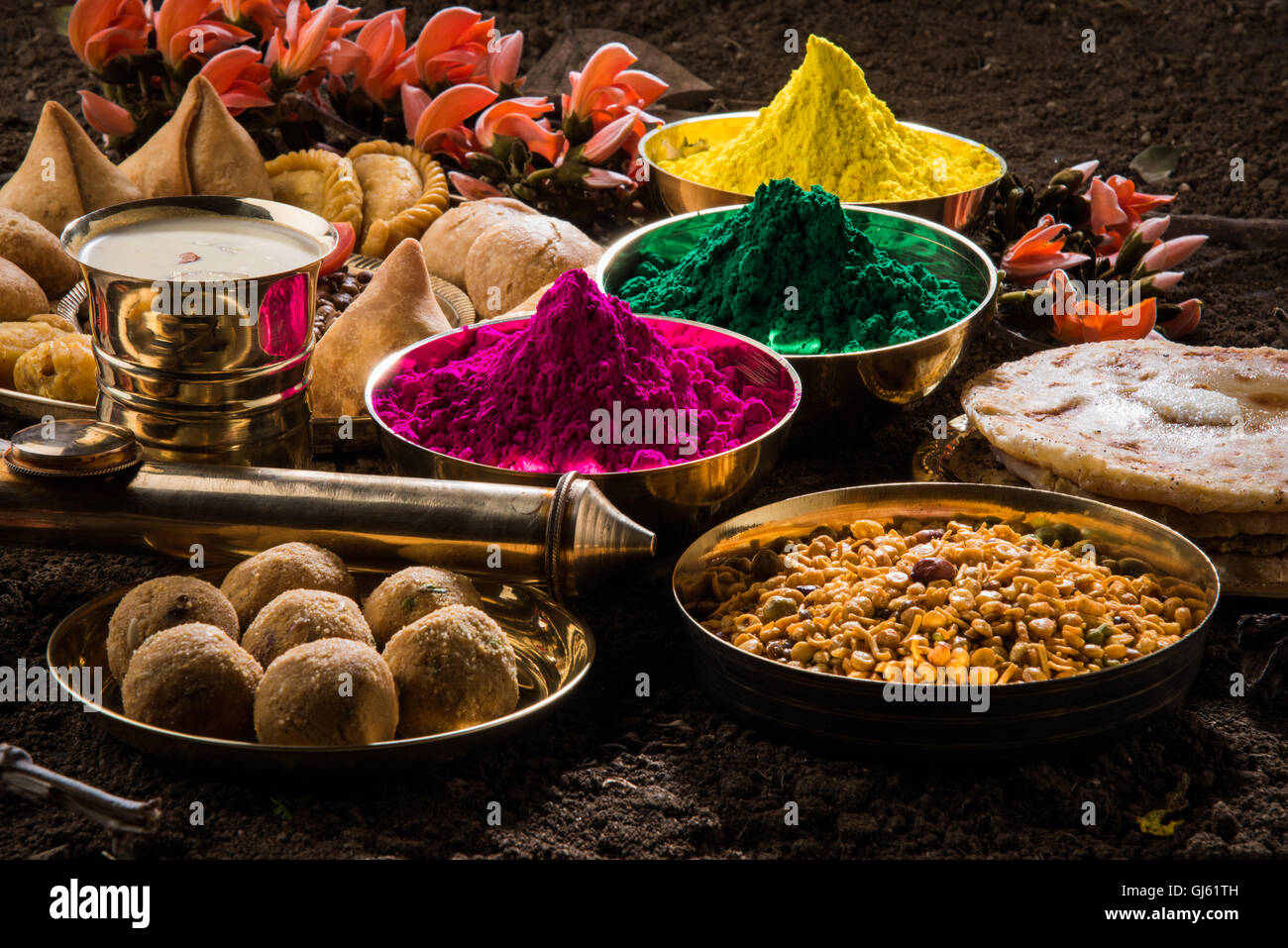 holi festival food with colours, indian festival holi, samosa, kachori ...