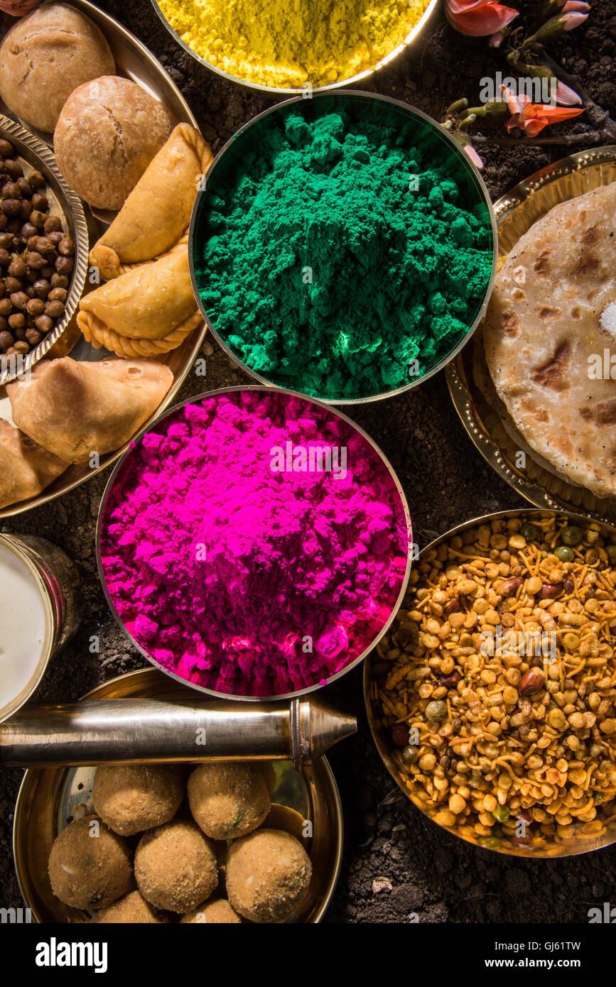 holi festival food with colours, indian festival holi, samosa, kachori ...