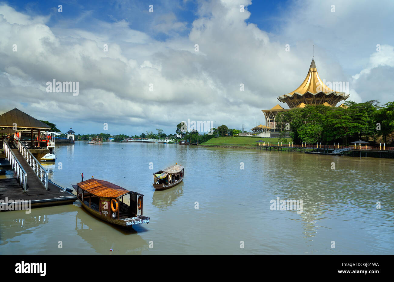 Kuching, Malaysia. Traditional boats on Sarawak river from waterfront ...
