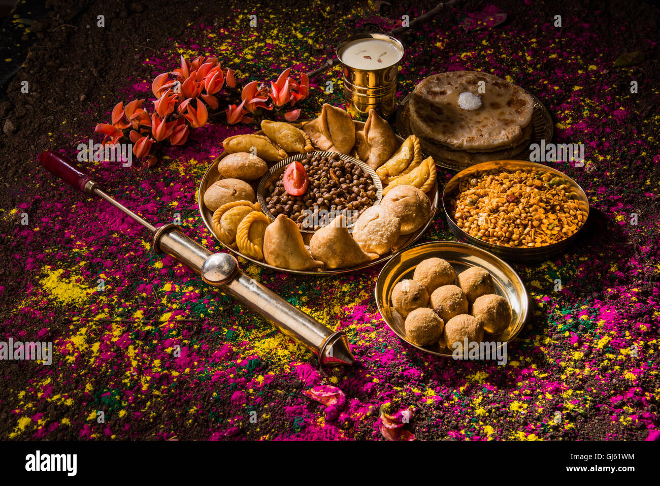 holi festival food with colours, indian festival holi, samosa, kachori ...