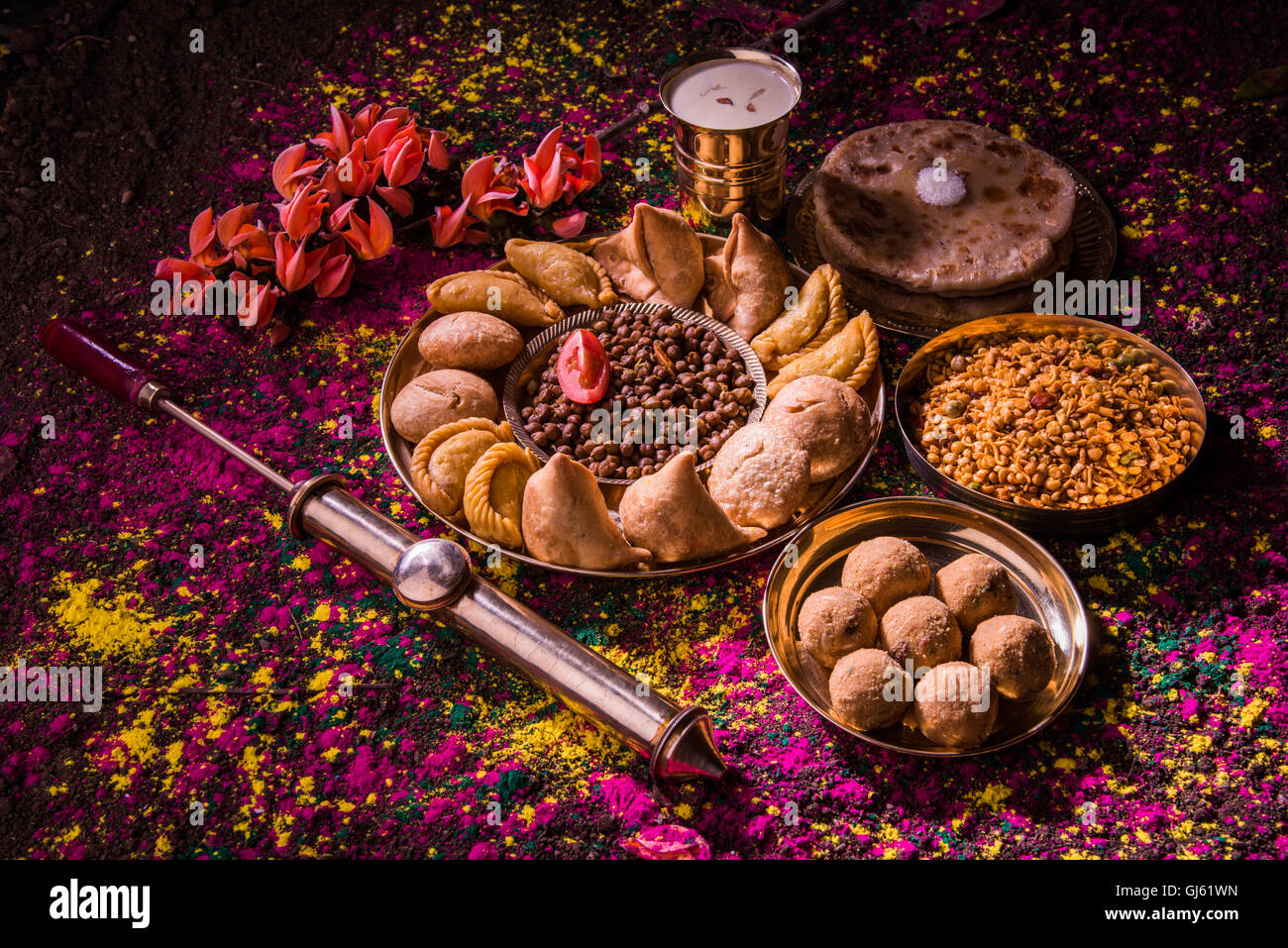holi festival food with colours, indian festival holi, samosa, kachori ...