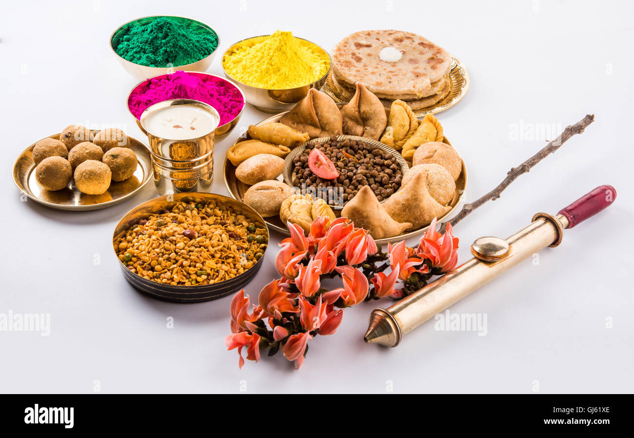 holi festival food with colours, indian festival holi, samosa, kachori ...
