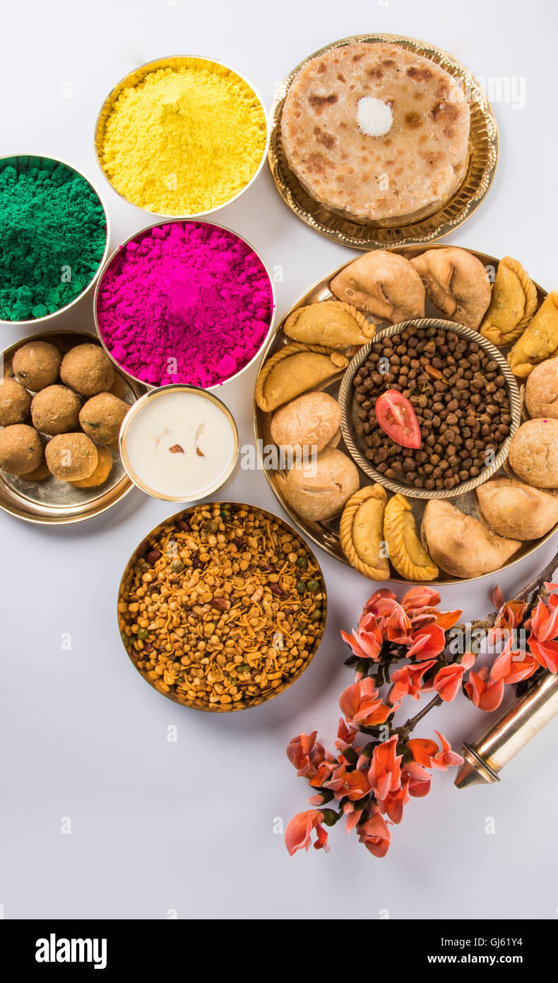 holi festival food with colours, indian festival holi, samosa, kachori ...