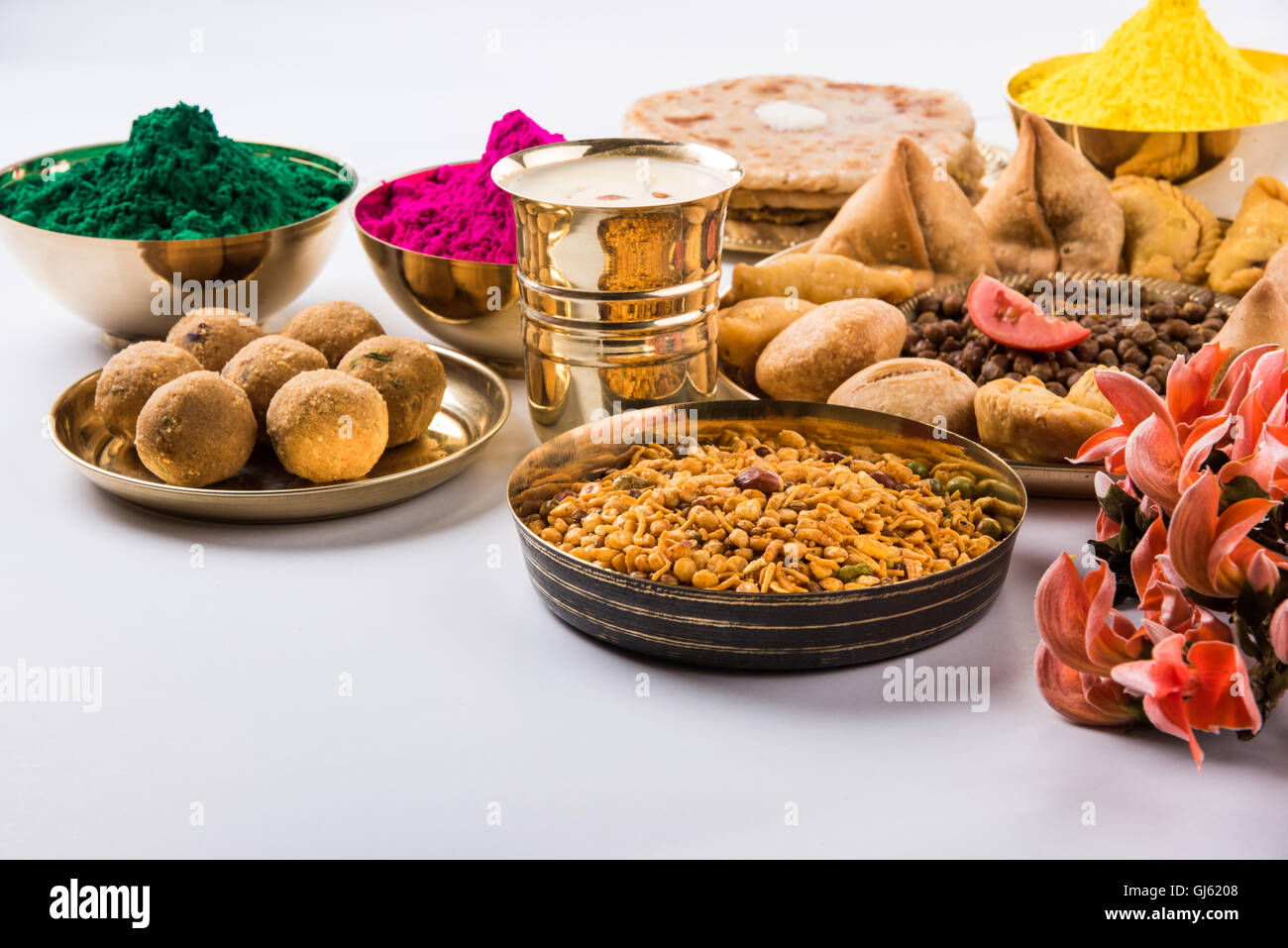 holi festival food with colours, indian festival holi, samosa, kachori ...