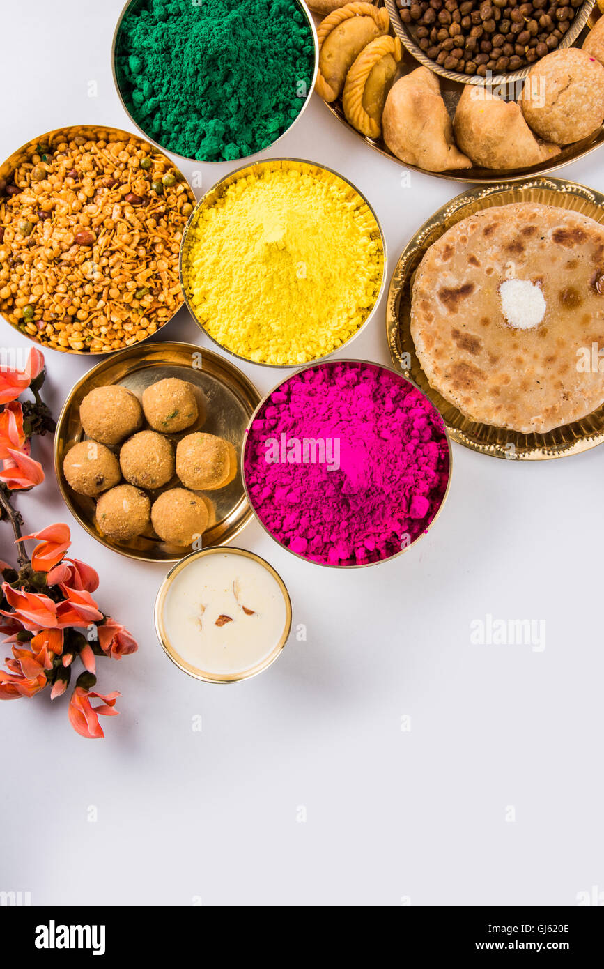 holi festival food with colours, indian festival holi, samosa, kachori ...