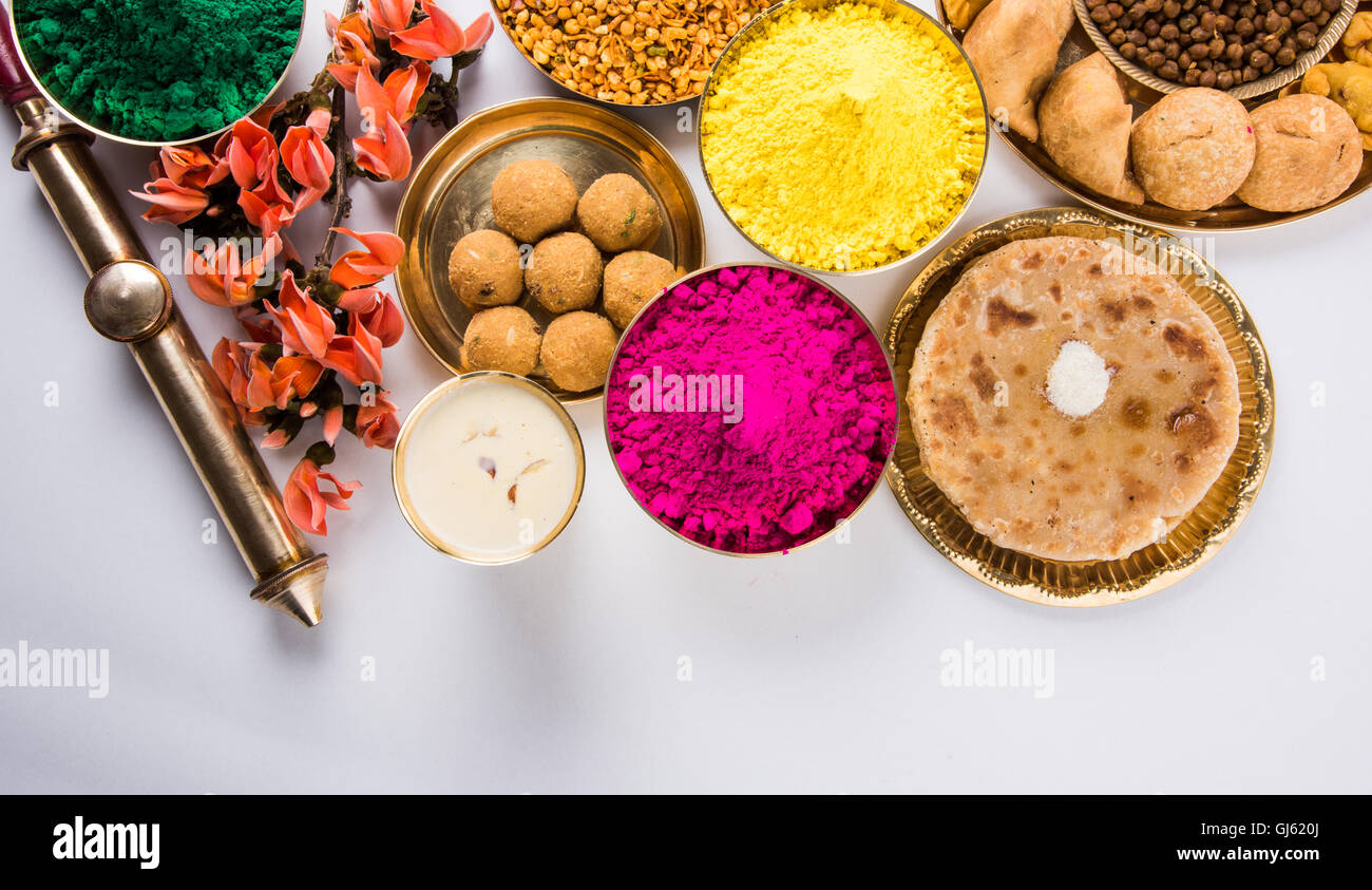 holi festival food with colours, indian festival holi, samosa, kachori ...