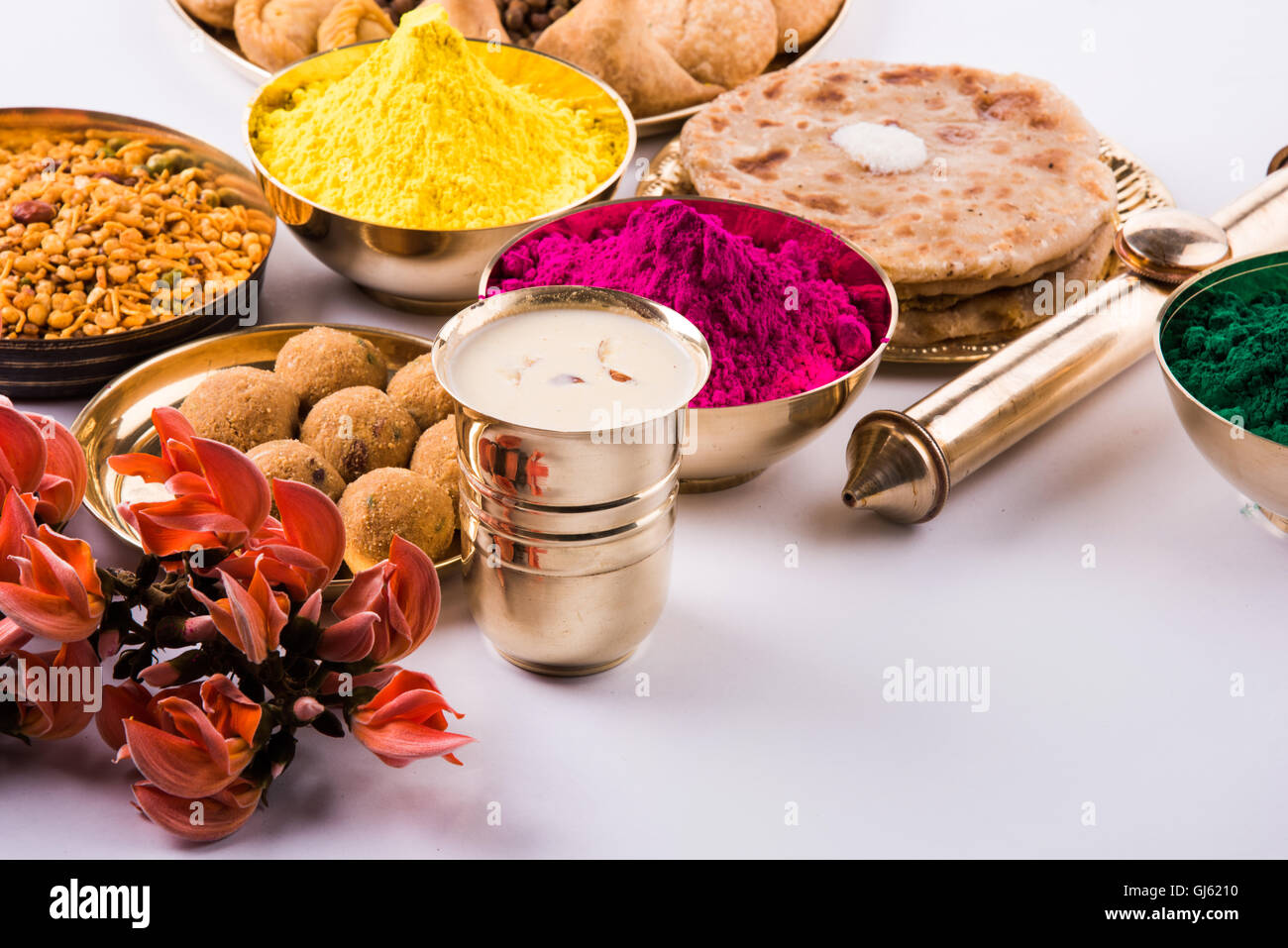 holi festival food with colours, indian festival holi, samosa, kachori ...
