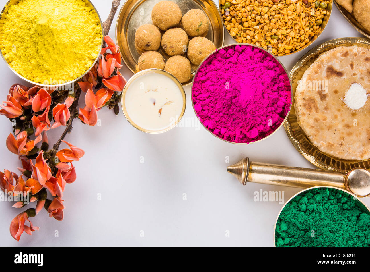 holi festival food with colours, indian festival holi, samosa, kachori ...