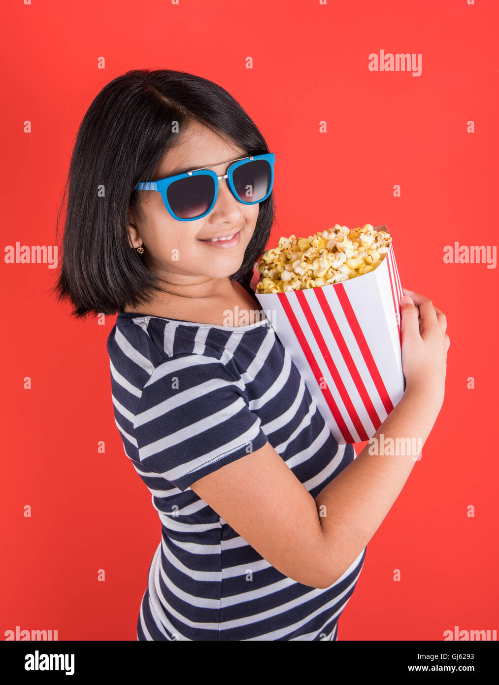 happy girl eating popcorn, indian girl eating popcorn, asian girl and ...