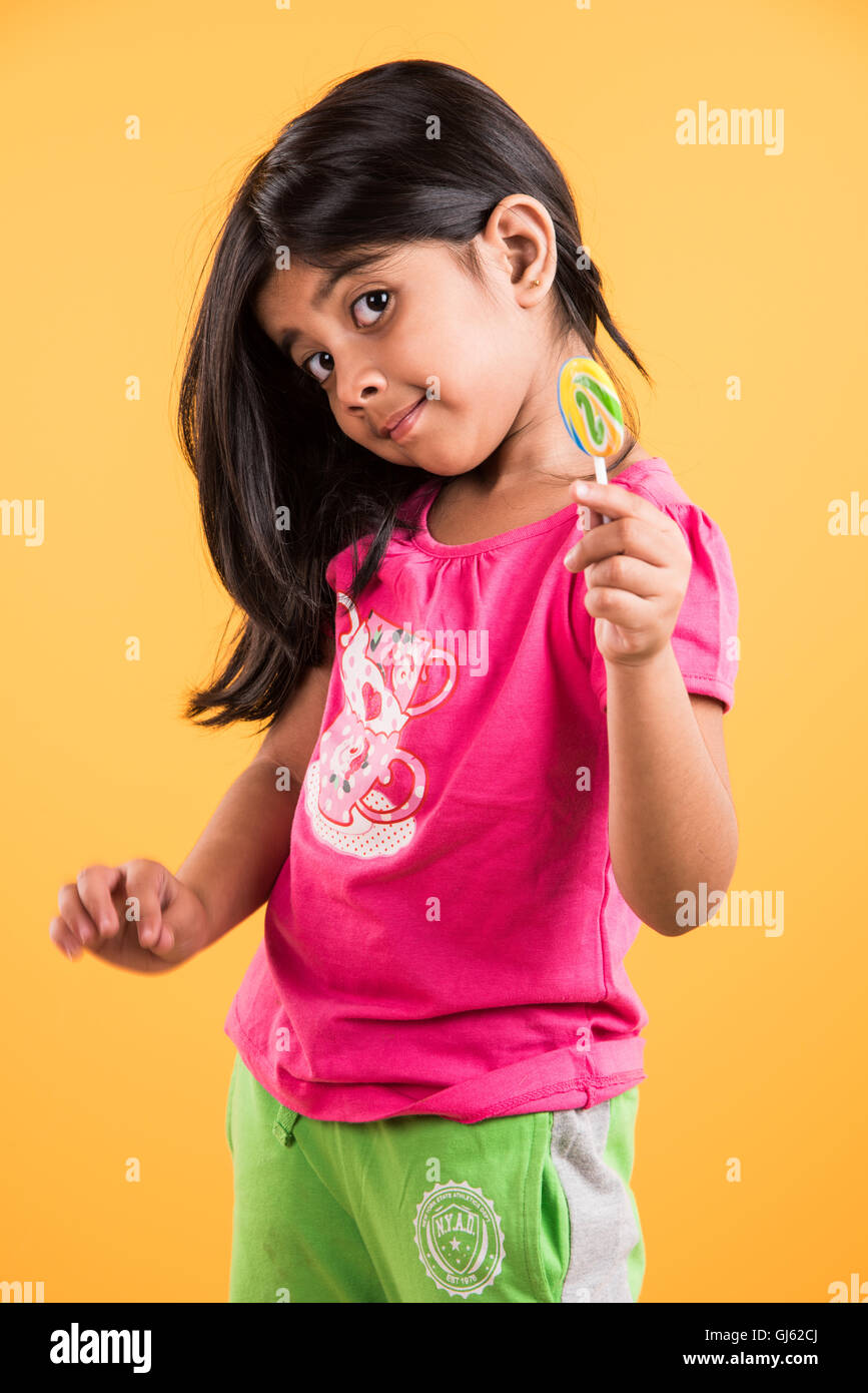 indian small girl with lolipop or loly pop, asian girl and lolipop or ...