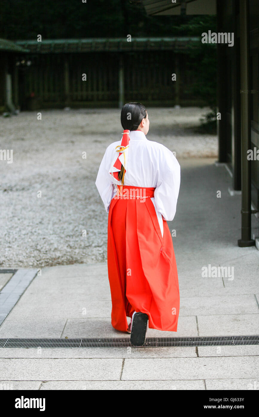 Shrine maiden at a traditional Japanese Shinto wedding ceremony at ...