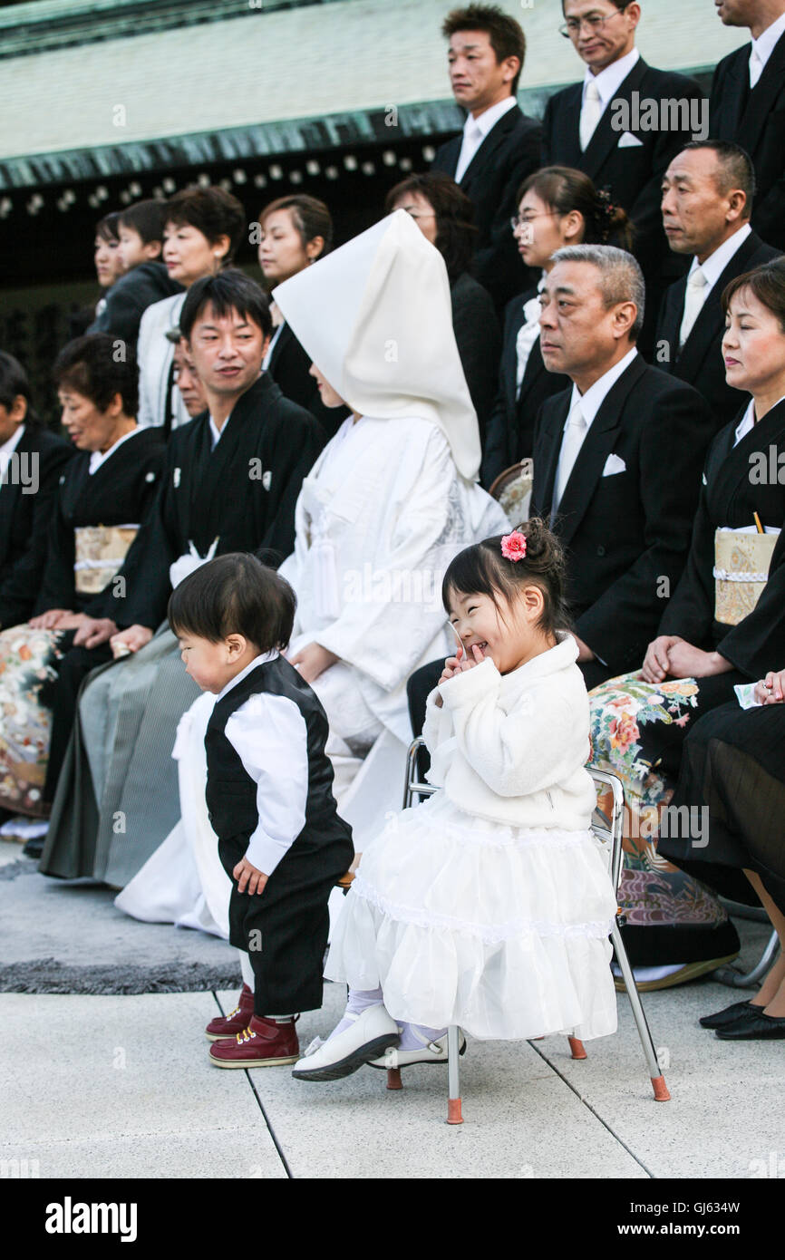 At a traditional Japanese Shinto wedding ceremony, the bride and groom ...