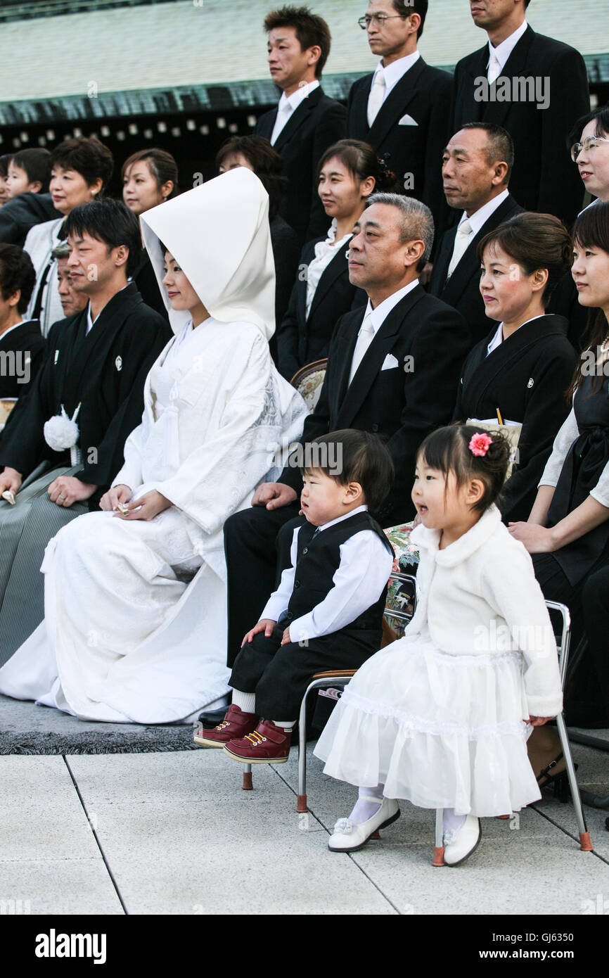 At a traditional Japanese Shinto wedding ceremony, the bride and groom ...